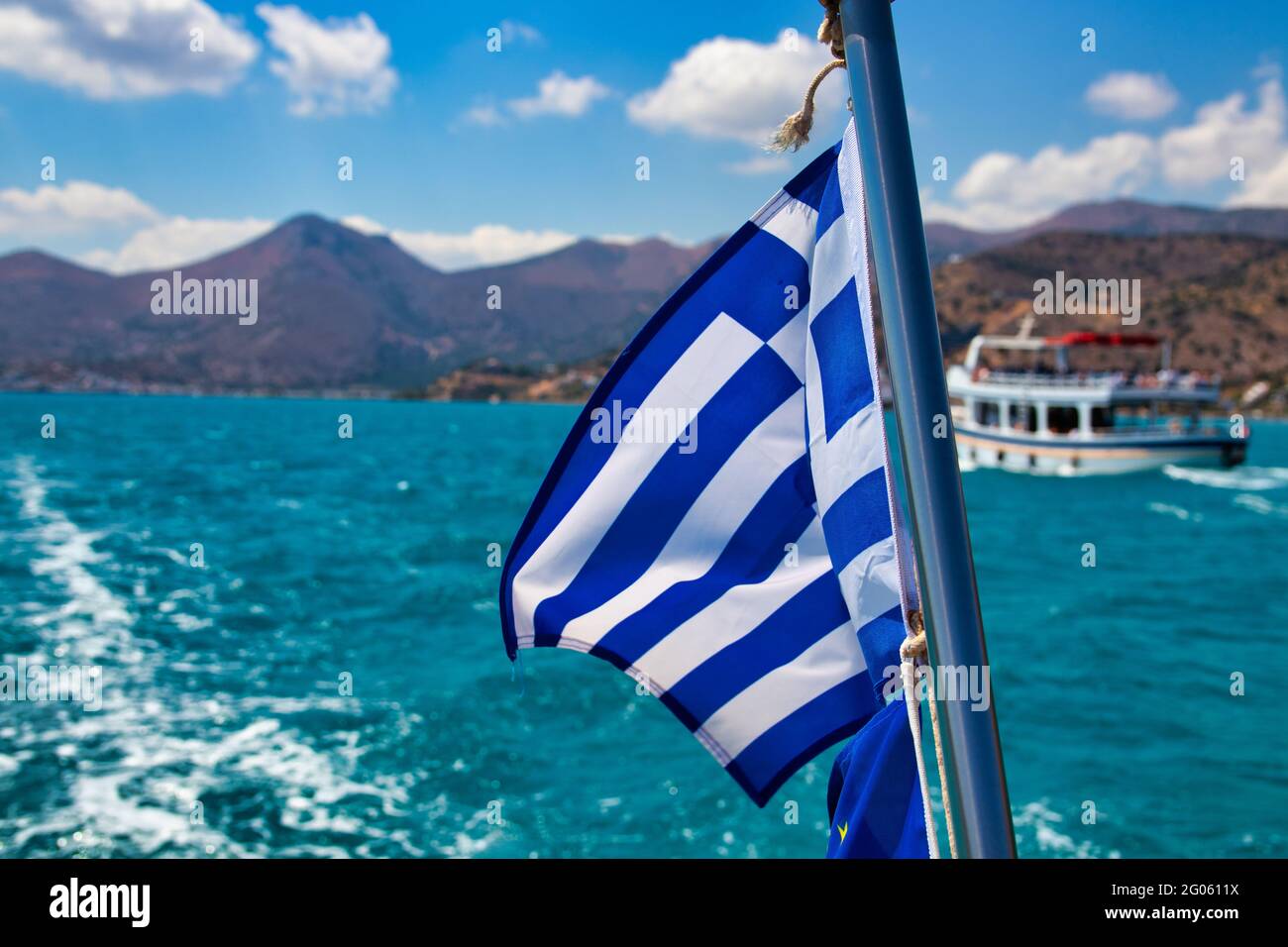 A waving flag of Greece on a ship off the Greek coast Stock Photo - Alamy