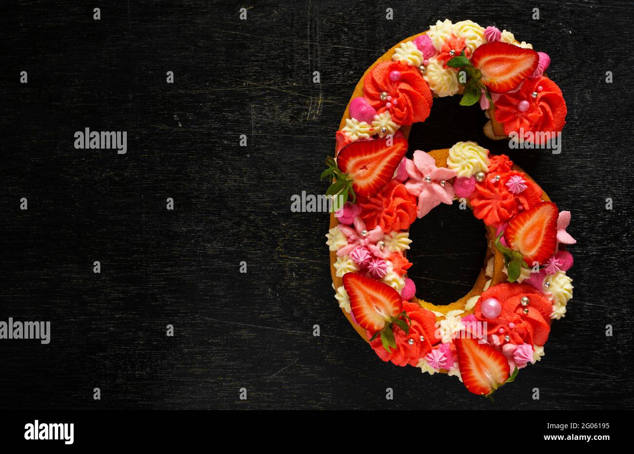 Beautiful cake in the shape of number 6. Modern trendy design ...