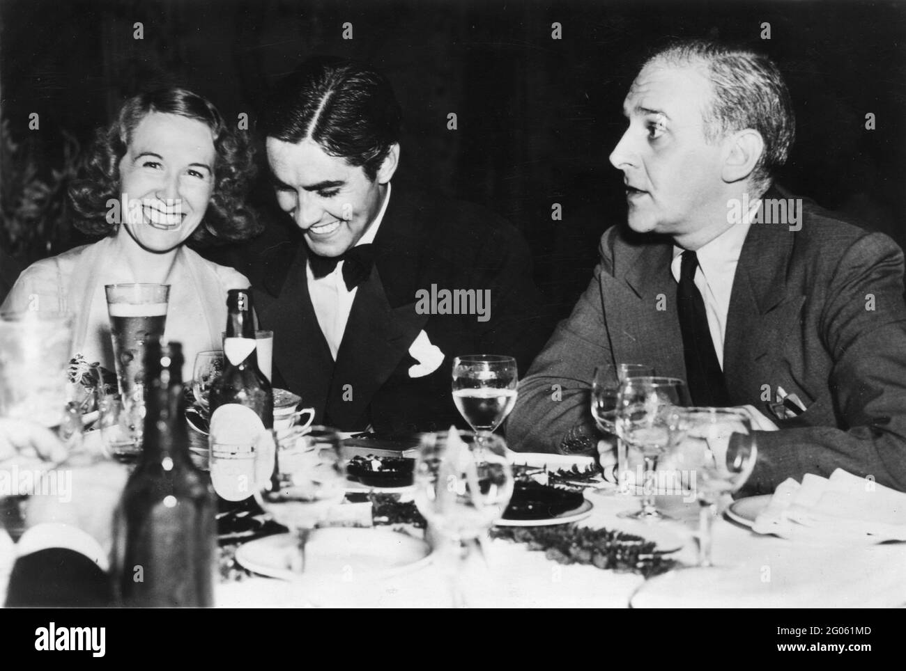 MRs. DARRYL F. ZANUCK TYRONE POWER and columnist WALTER WINCHELL atop ...