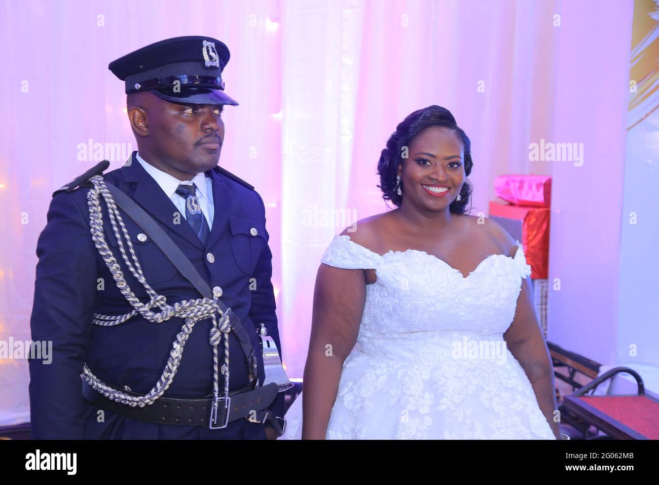 KAMPALA, UGANDA - May 31, 2021: The bride and the groom pose for a ...
