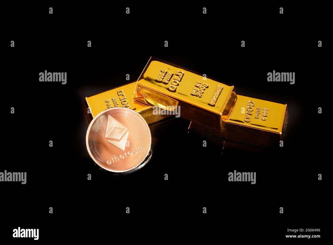 Real Ethereum token coin on some very valuable gold bars, isolated on ...