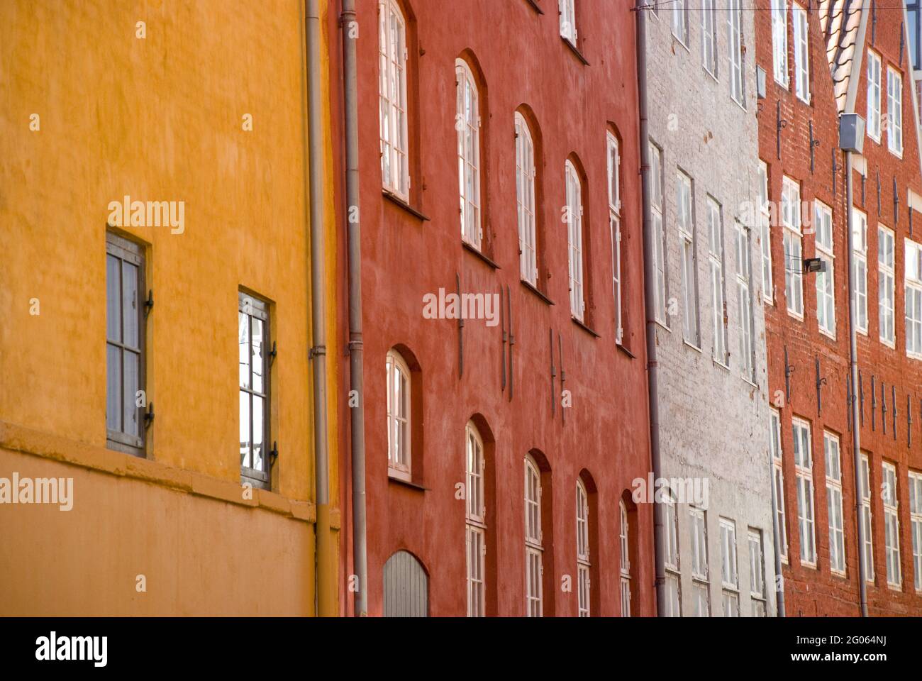 View along multi colored facades of houses in Copenhag Stock Photo - Alamy
