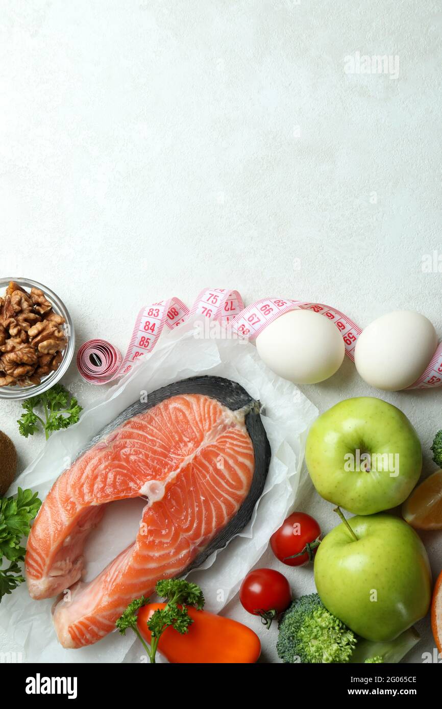 Healthy nutrition concept on white textured background, space for text ...
