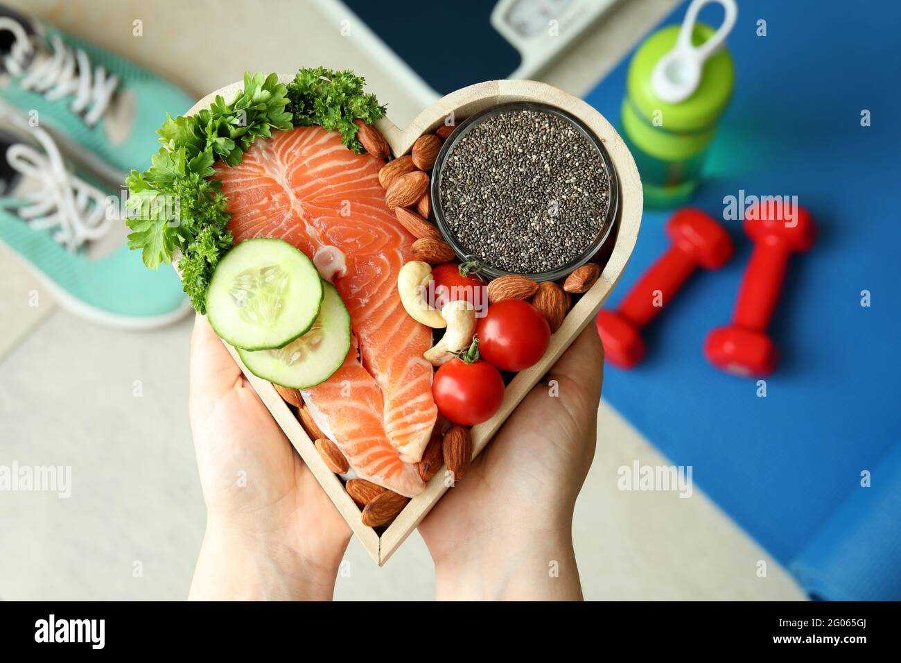 Female hands hold healthy food in heart, top view Stock Photo - Alamy