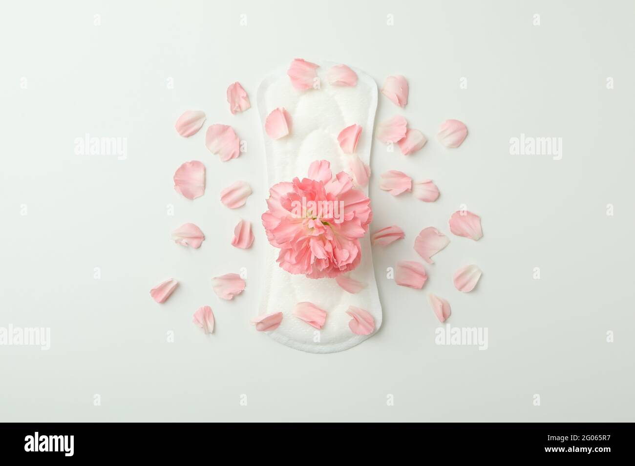 Hygiene pad with flower and petals on white background Stock Photo - Alamy