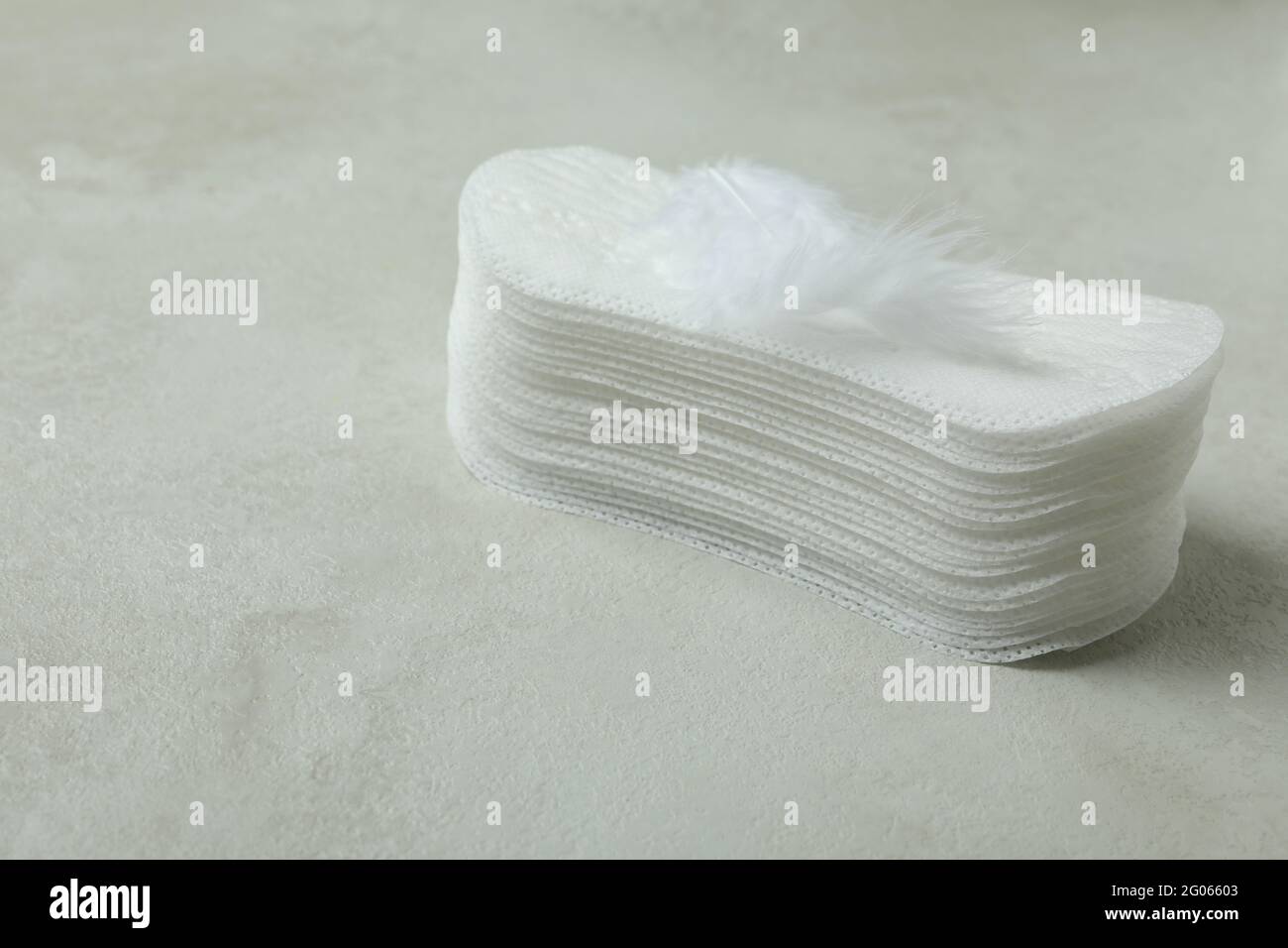 Stack of sanitary pads on white textured background Stock Photo - Alamy