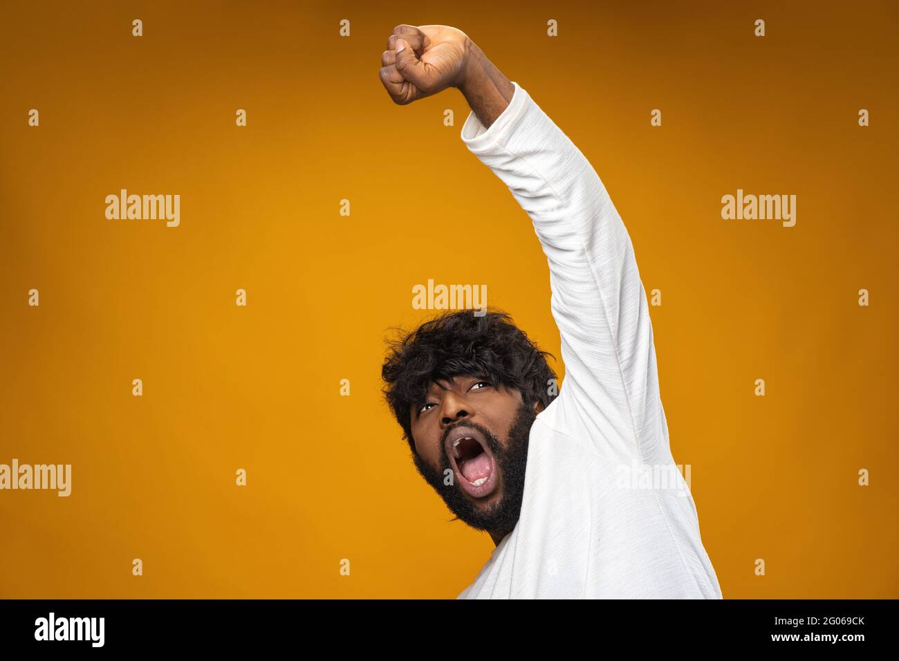 Portrait of overjoyed black man celebrating success Stock Photo - Alamy