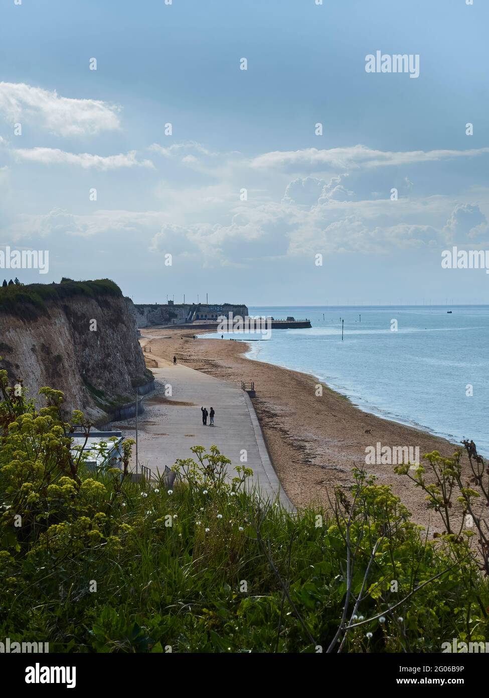 The sweep of Margate Beach, chalk cliff to one side, rippled blue sea ...