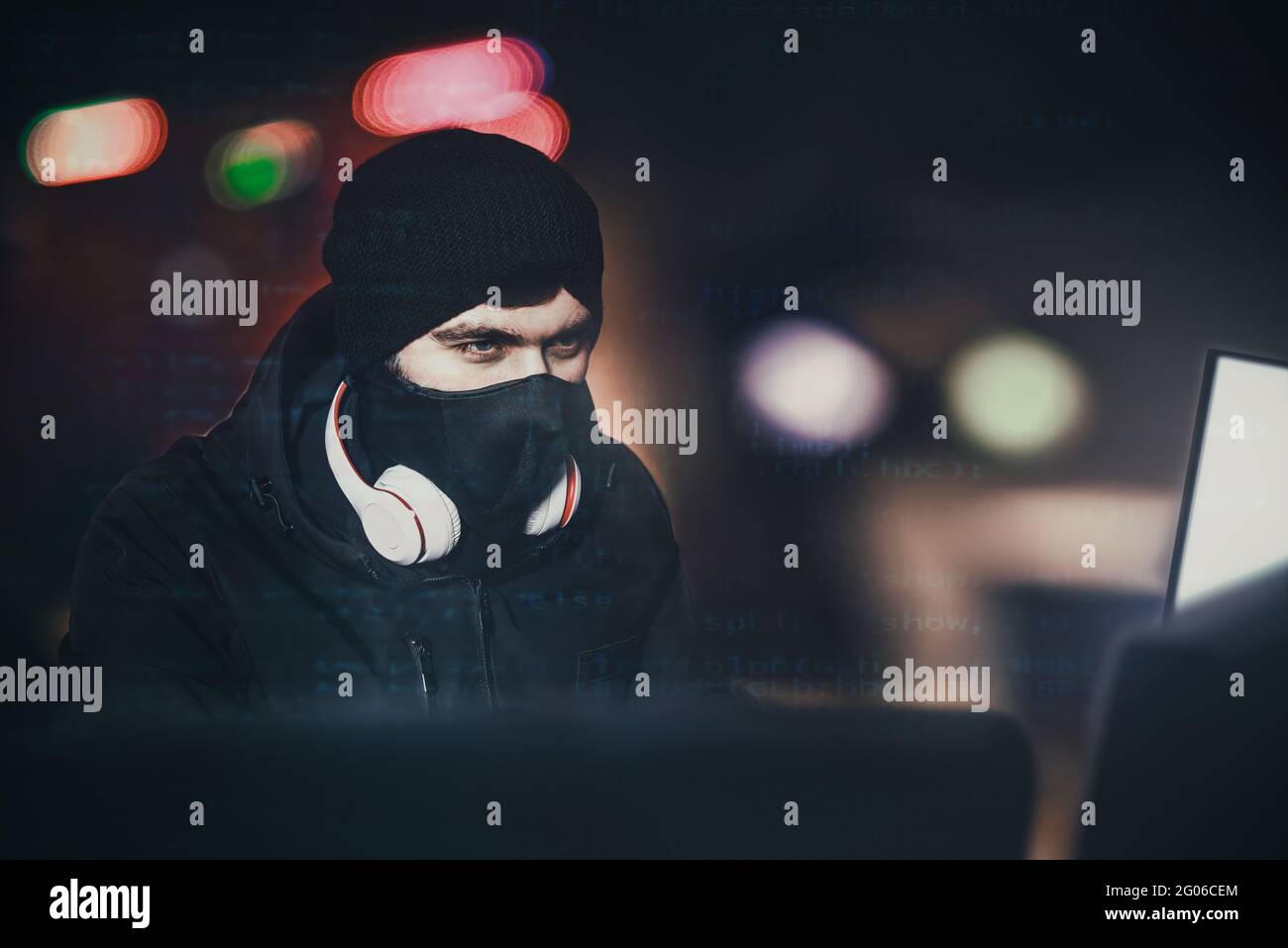 Angry computer hacker weared balaclava stealing data from laptop in ...