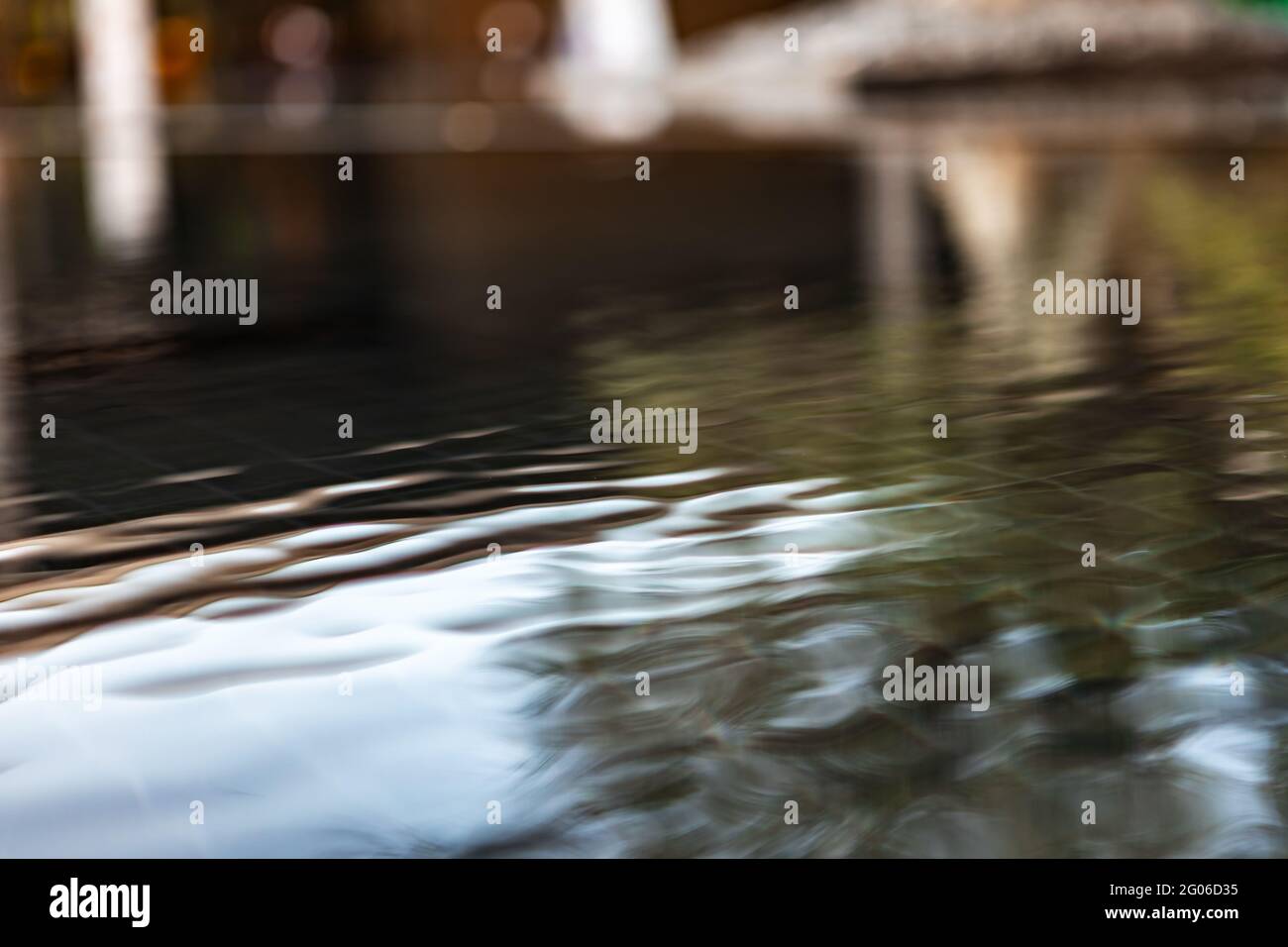 Dark smooth water surface in a lake Stock Photo - Alamy
