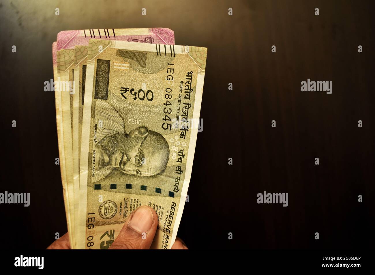 Man Holding Indian Currency Notes Stock Photo - Alamy