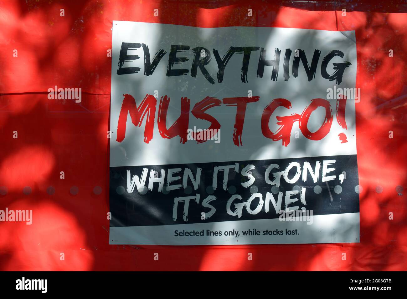 Closing down sale sign in a shop window. Bright red background where ...