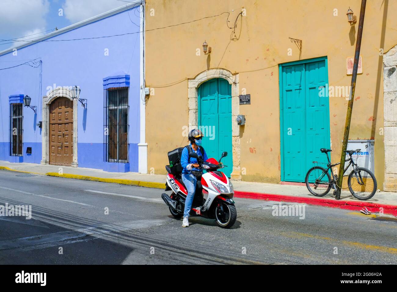 Person on a motorcycle in downtown Merida, Yucatan, Mexico Stock Photo ...