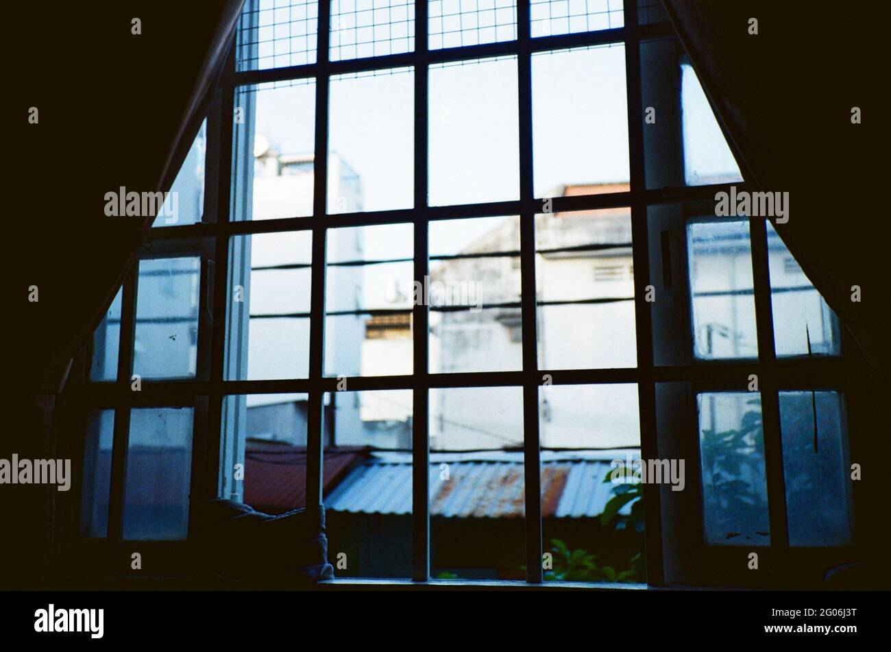 Shot of a big window with little rectangular glasses looking at the ...