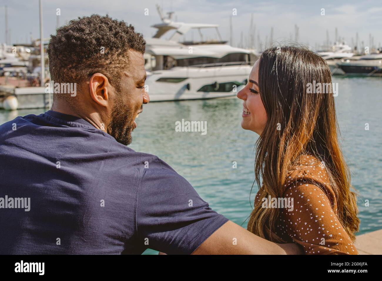 Multiethnic Young Couple Laughing and Looking Each Other with Love ...