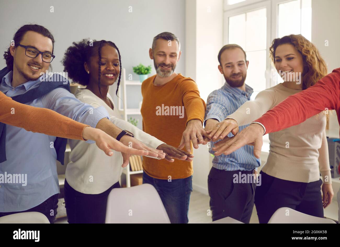 Group of diverse hands together joining hi-res stock photography and ...