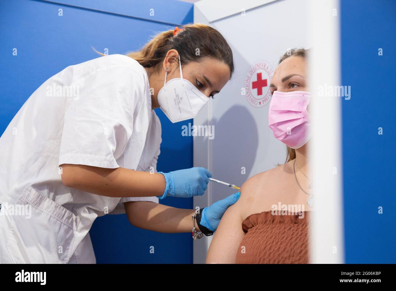 A student undergoes vaccination with Pfizer vaccine inside the ...