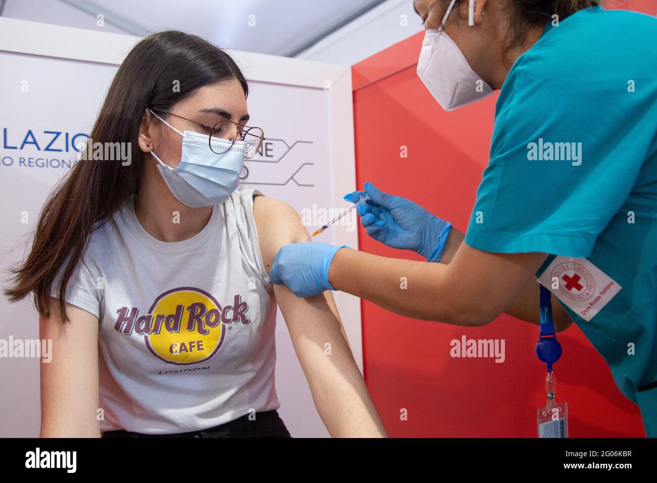 A student undergoes vaccination with Pfizer vaccine inside the ...