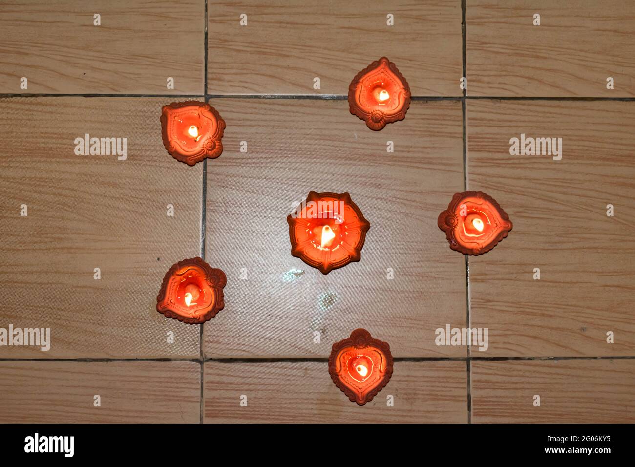 oil lamp or Diwali Diya also known as diva made of clay glowing ...