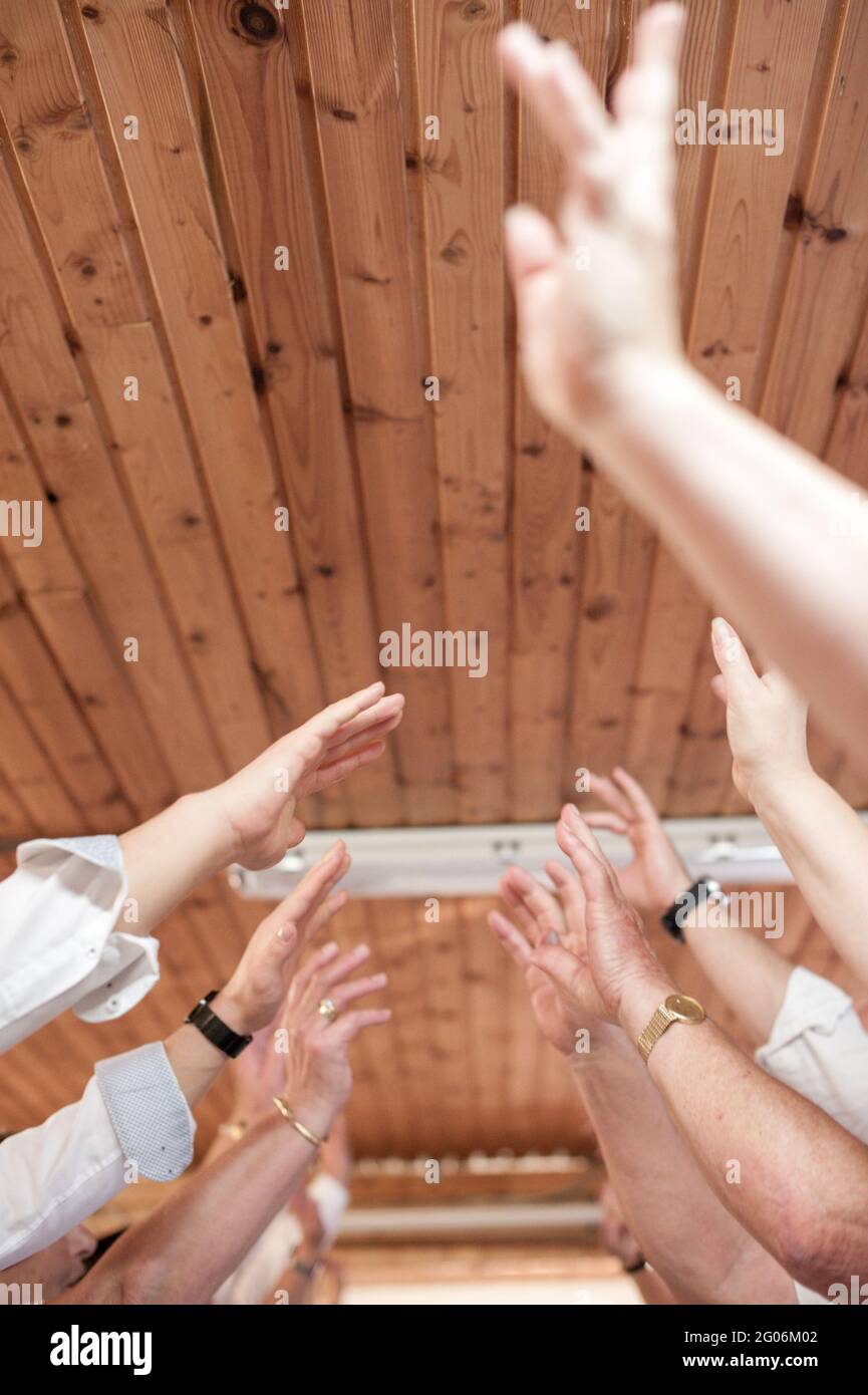 People throwing Hands in the air at a party Stock Photo - Alamy