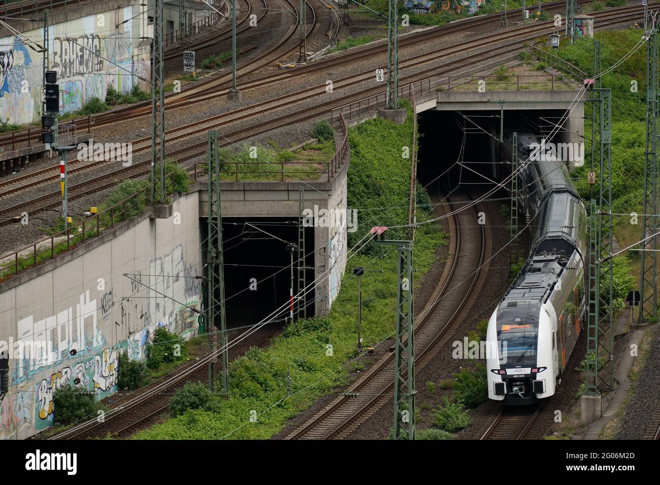 COLOGNE, GERMANY - May 23, 2021: railroad tracks crossing on different ...