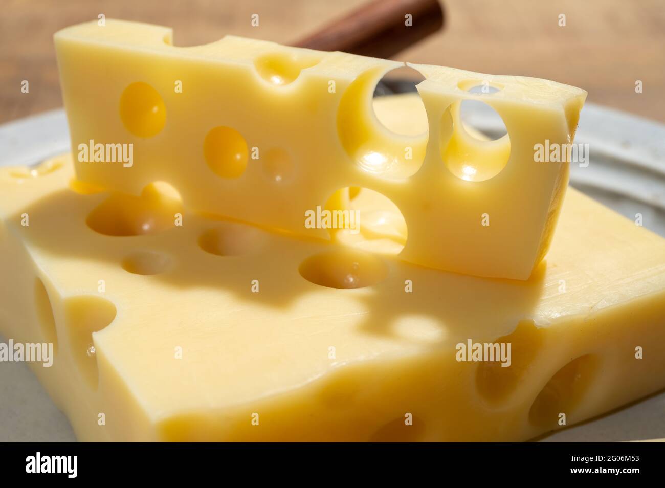 Cheese collection, blocks of French emmentaler cheese with many round ...