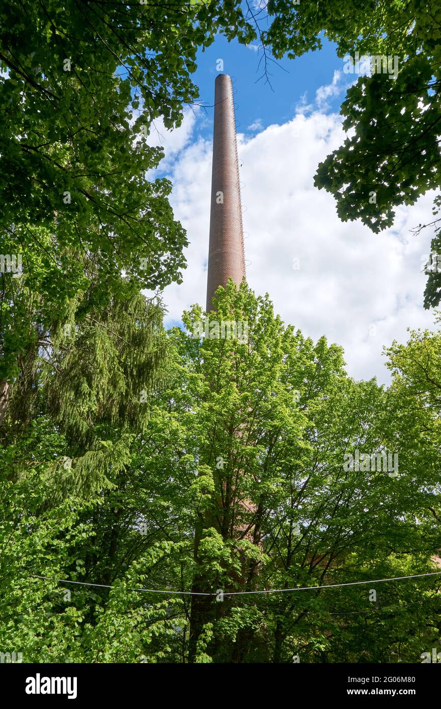 Shot of a tall tower with trees around and sky on the background Stock ...