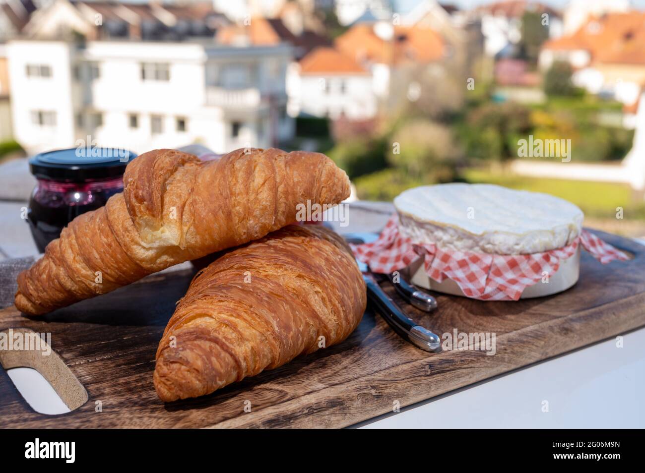 French breakfast with fresh baked croissants and cheeses from Normandy ...