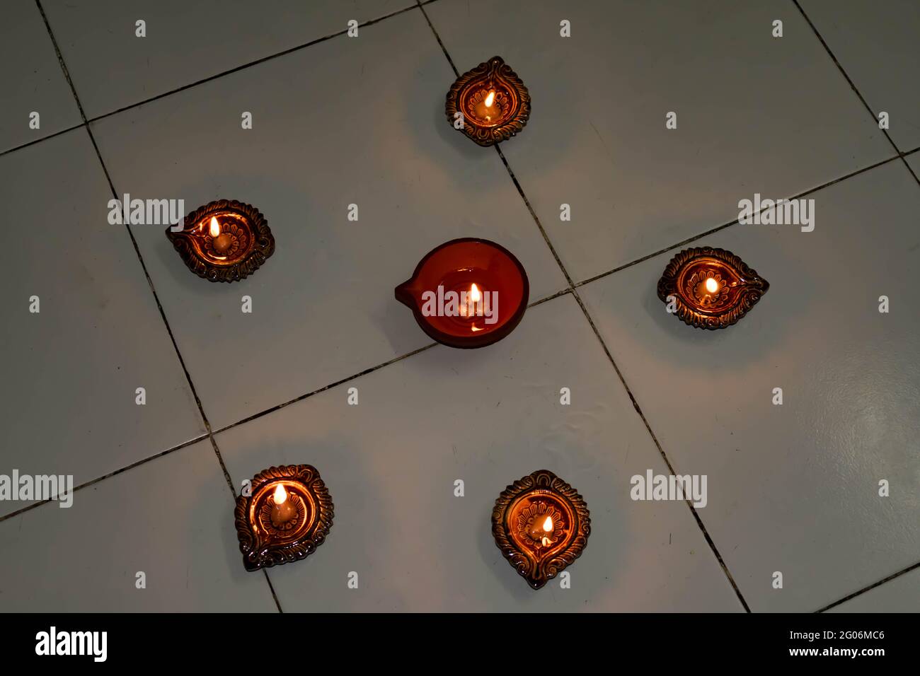 oil lamp or Diwali Diya also known as diva made of clay glowing ...