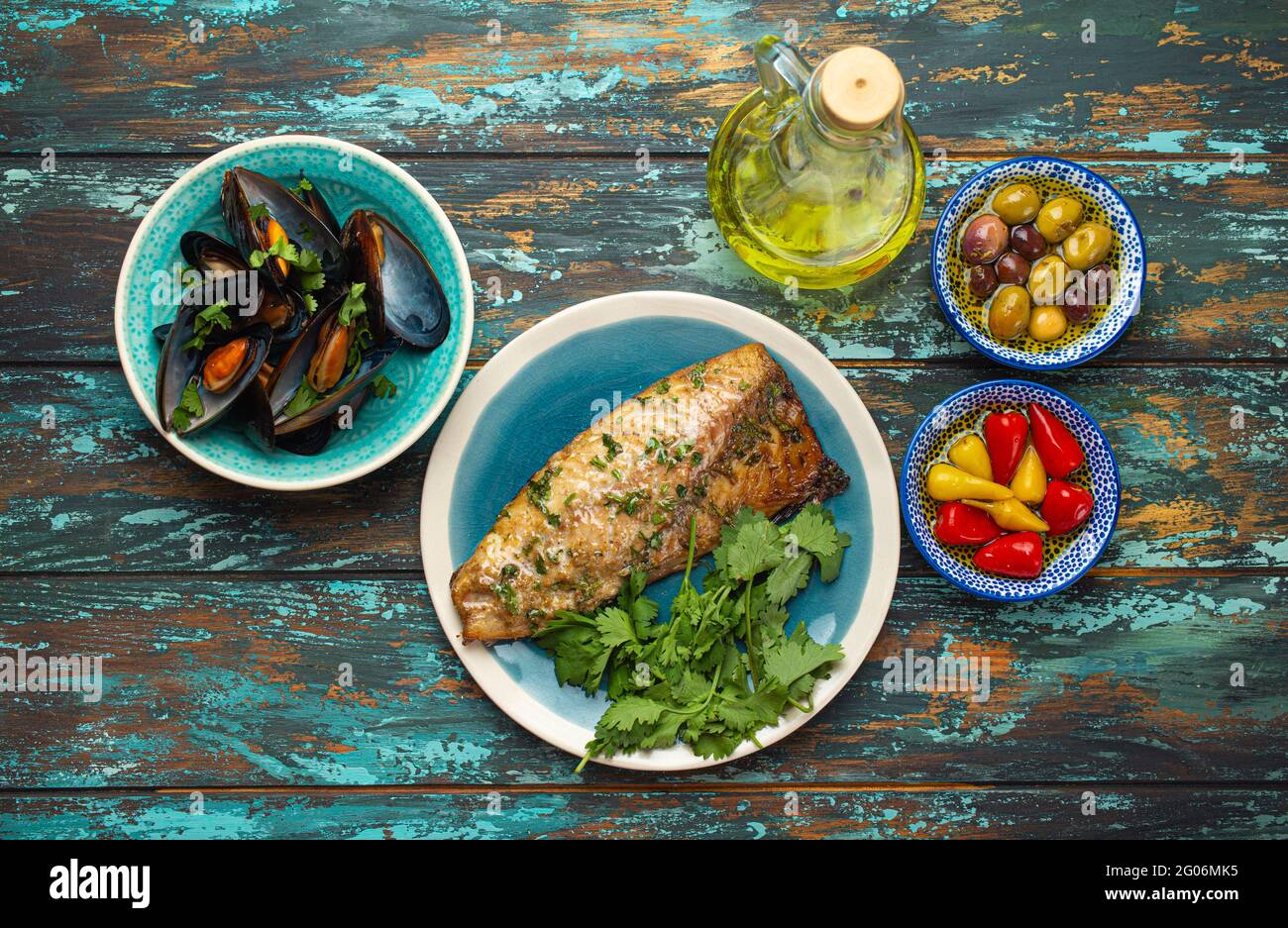 Greek meal with grilled fish and appetizers Stock Photo - Alamy