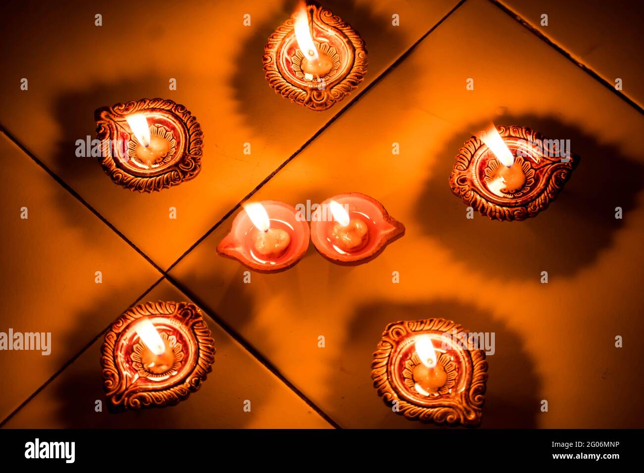 oil lamp or Diwali Diya also known as diva made of clay glowing ...