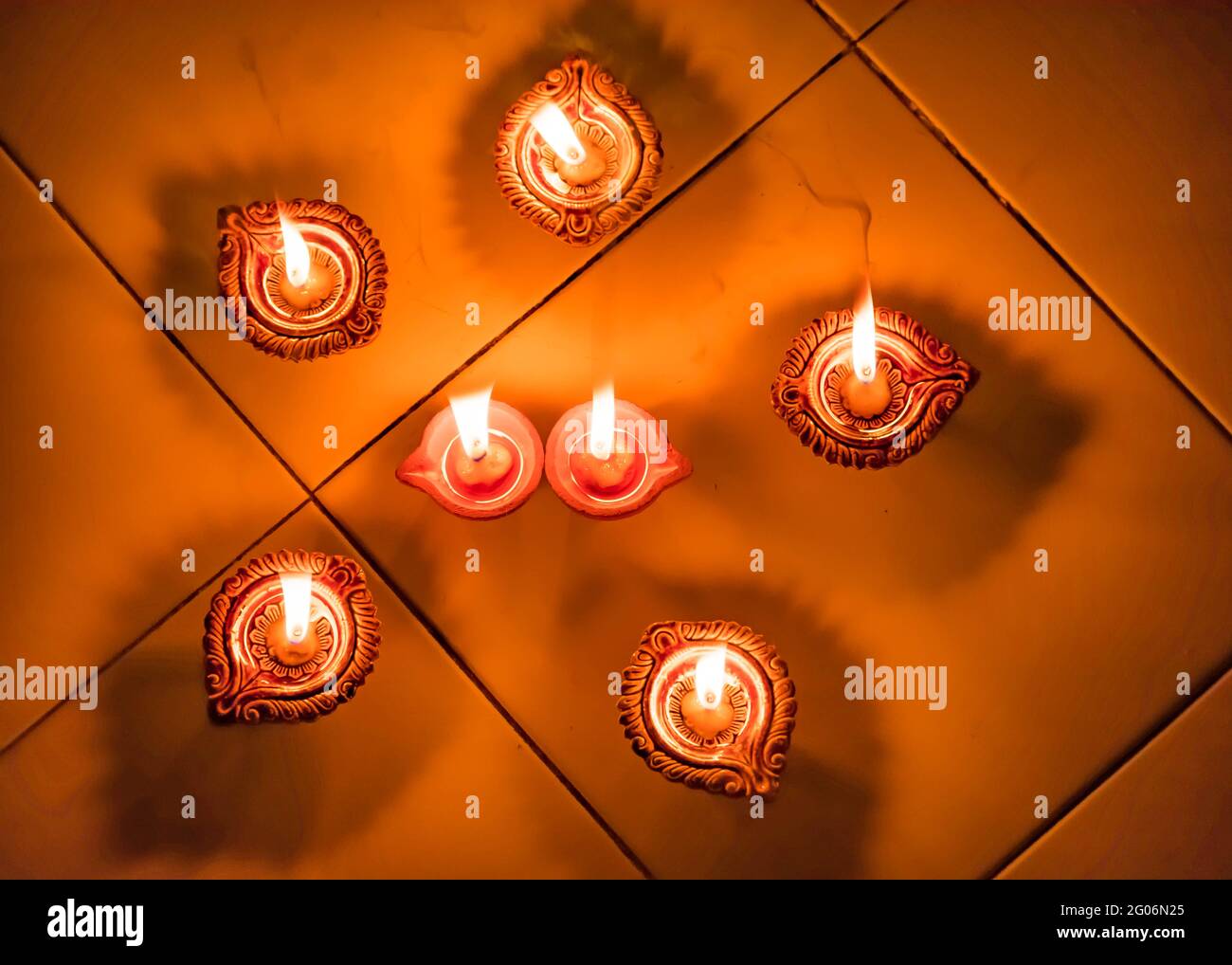 oil lamp or Diwali Diya also known as diva made of clay glowing ...