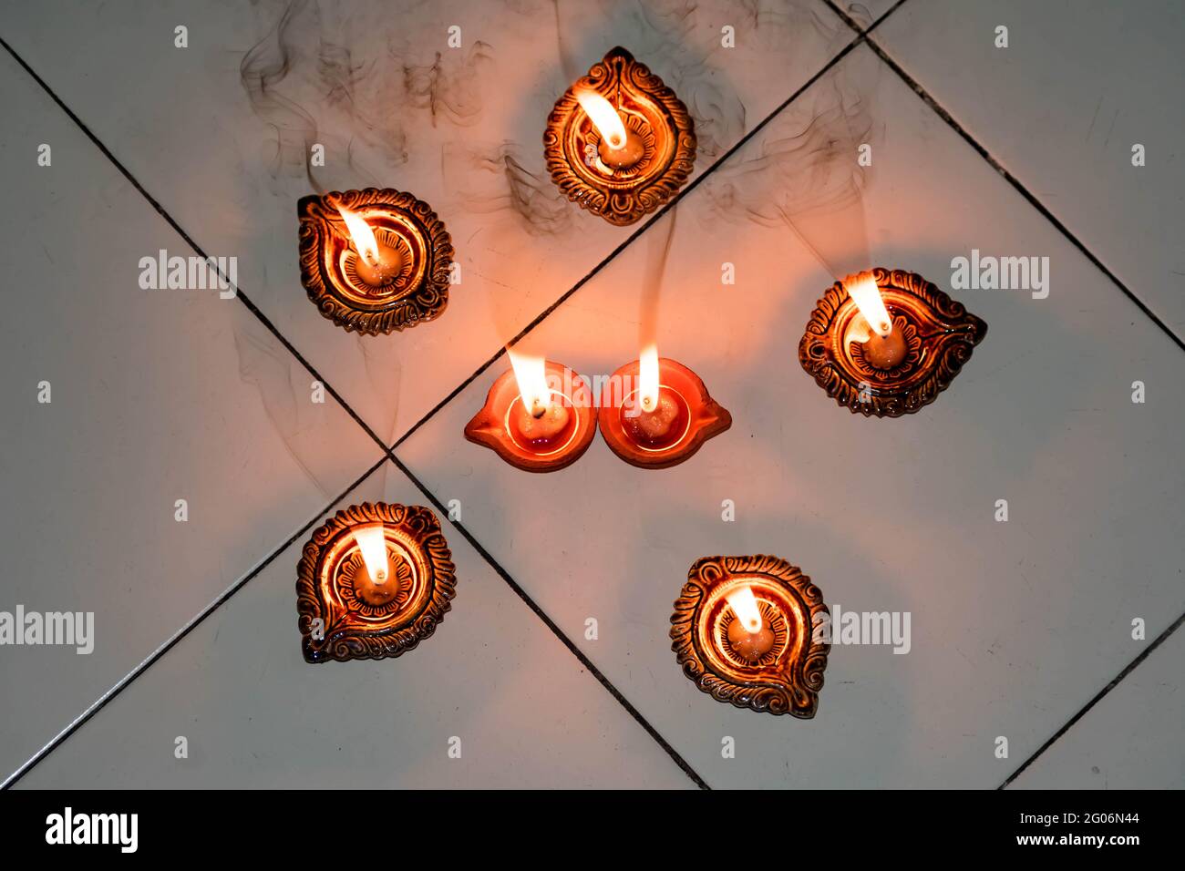 oil lamp or Diwali Diya also known as diva made of clay glowing ...