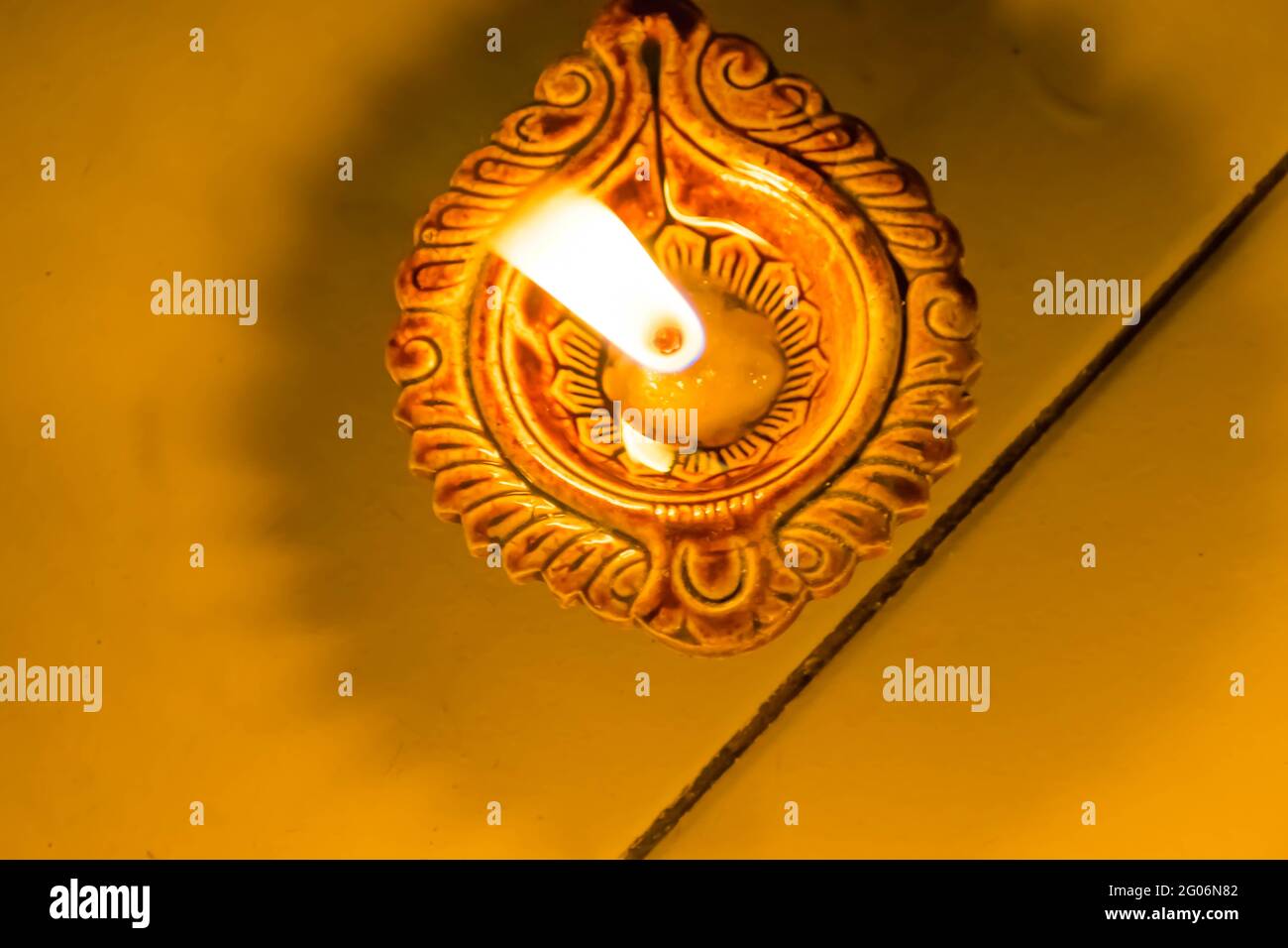 oil lamp or Diwali Diya also known as diva made of clay glowing ...