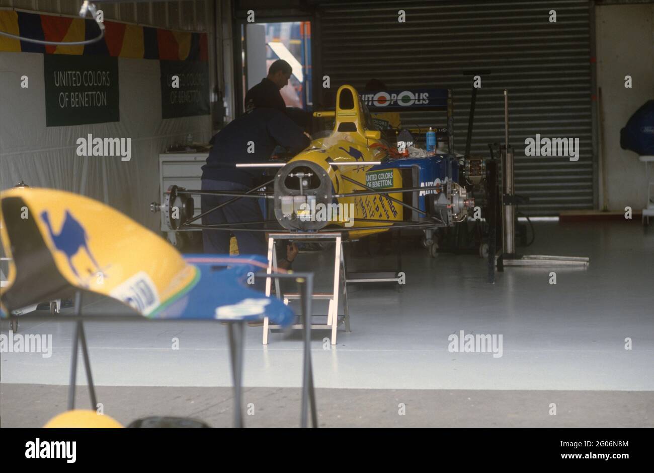 Mechanics working on the Lotus 102B in the pits during practice for the ...