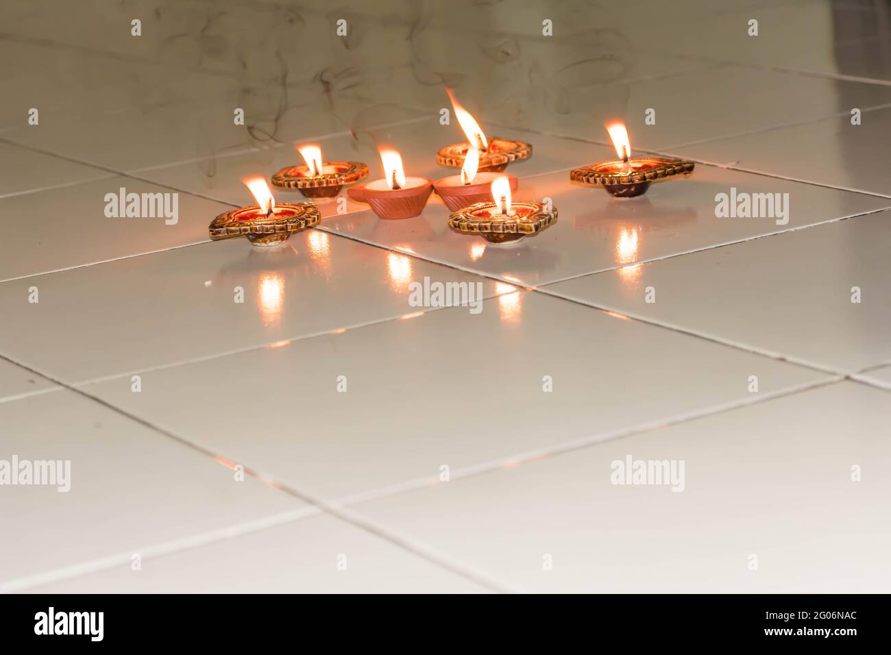 oil lamp or Diwali Diya also known as diva made of clay glowing ...