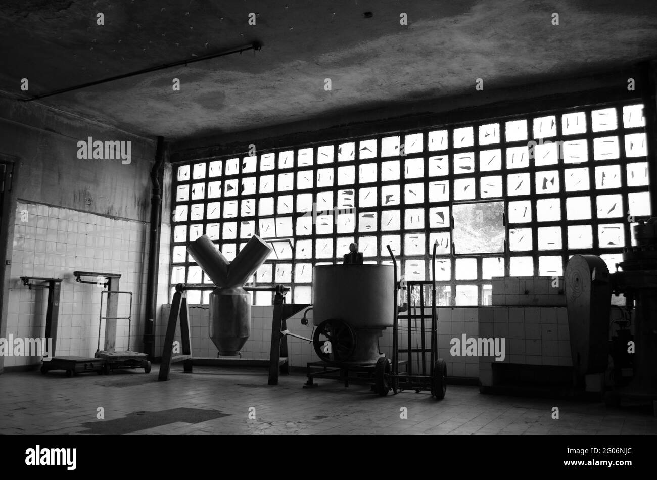 Grayscale shot of a small factory Stock Photo - Alamy