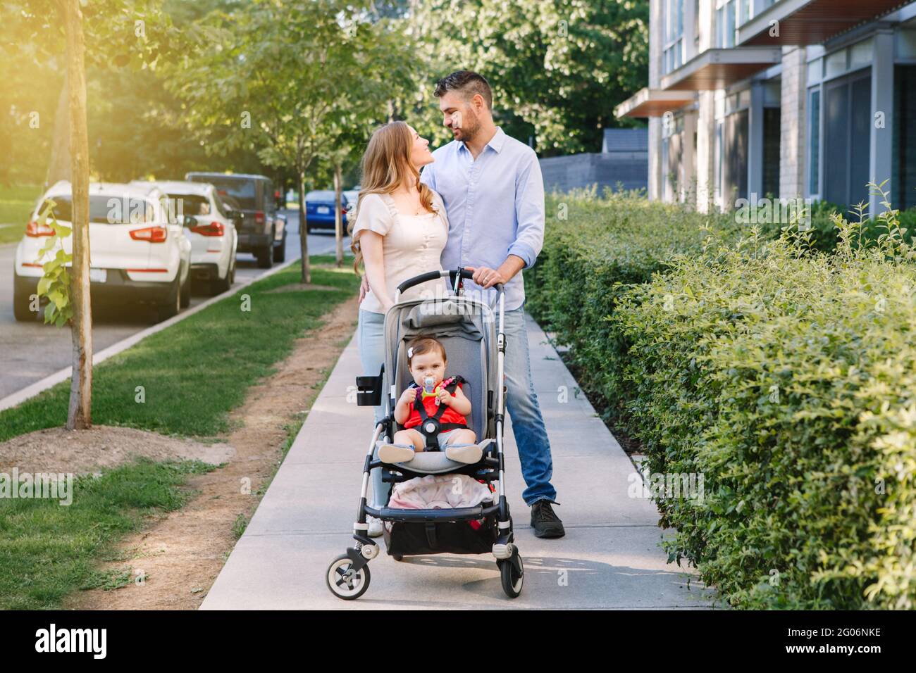 Urban life with kids children. Caucasian mother and father walking with ...