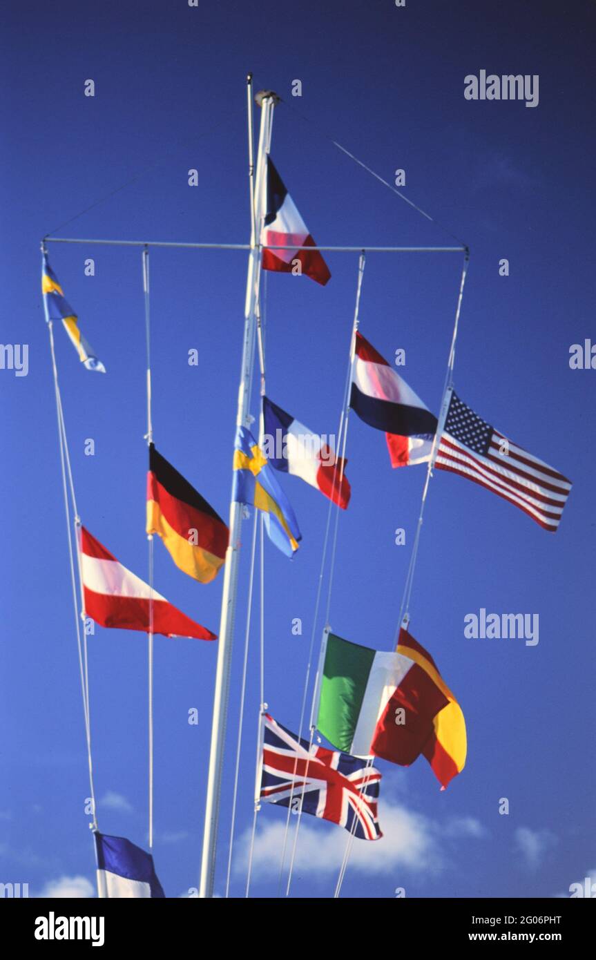 1990s St. Barts (Saint Barthélemy) – Flags of many nations fly over the ...