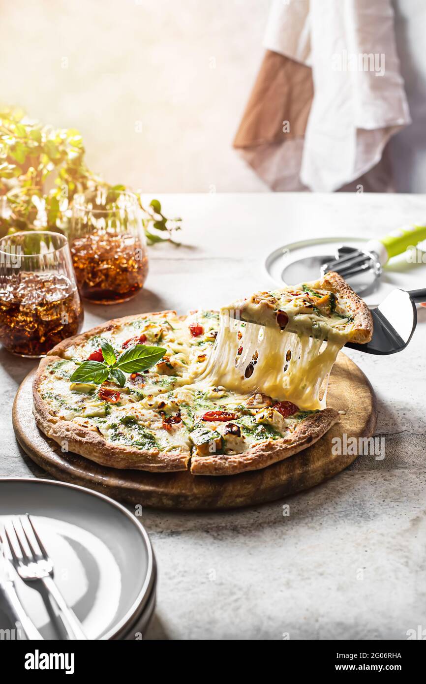 A slice of hot melting cheese pizza. Italian traditional food on a ...