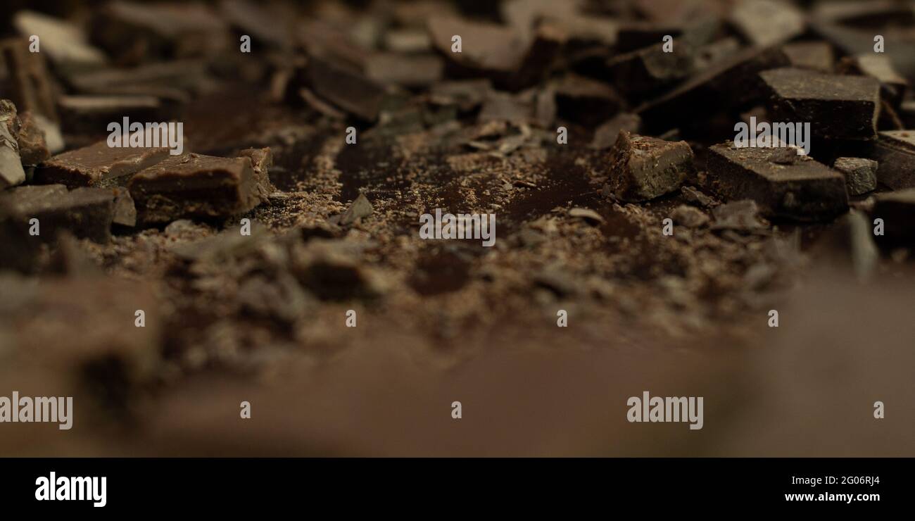 Chocolate dust with chocolate chunks Stock Photo - Alamy