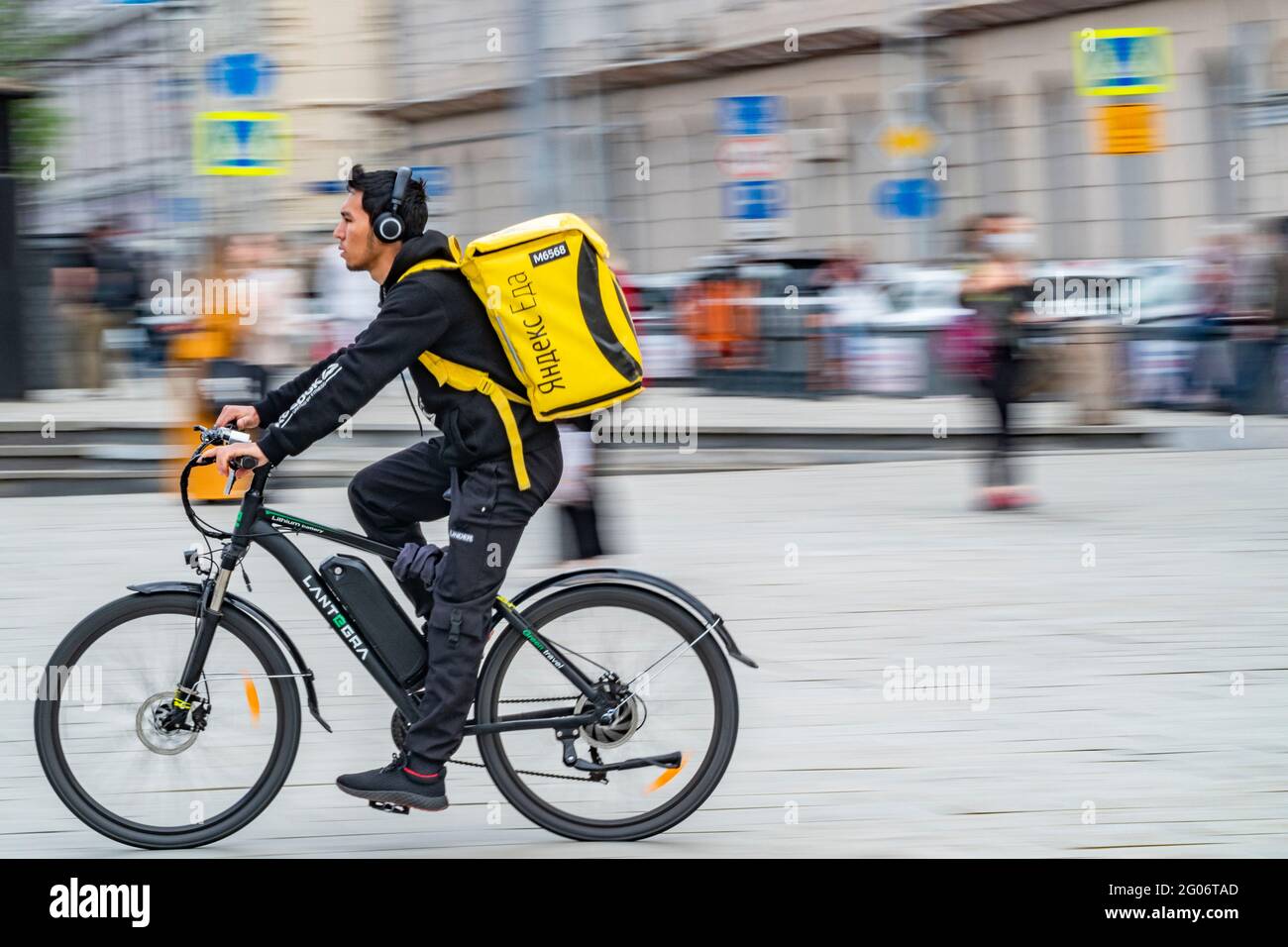 Russia, Moscow. A food delivery service courier rides a bicycle Stock ...