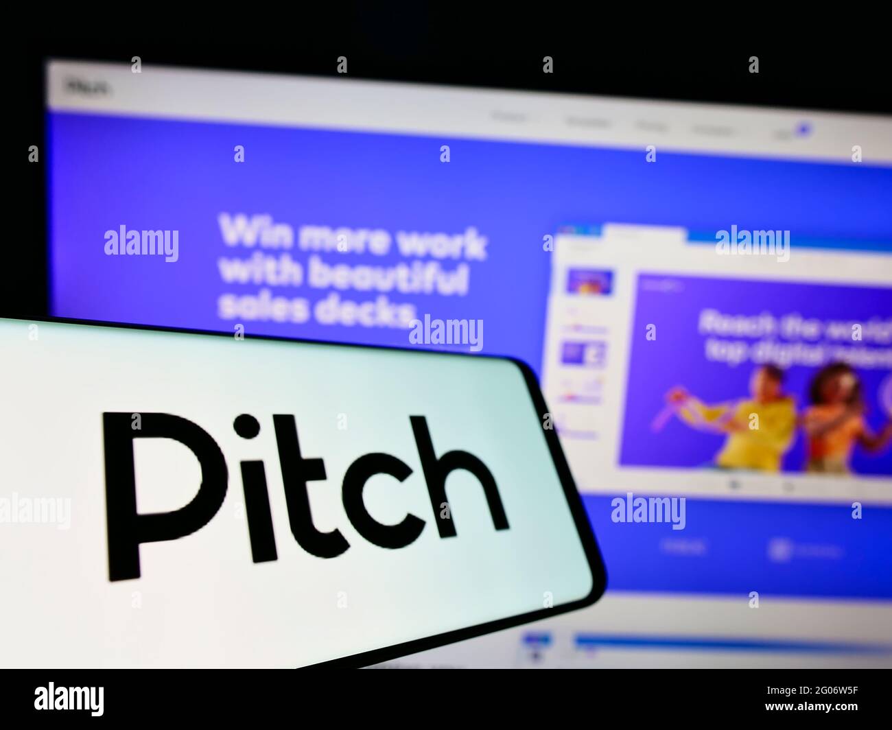 Cellphone with logo of German company Pitch Software GmbH on screen in ...
