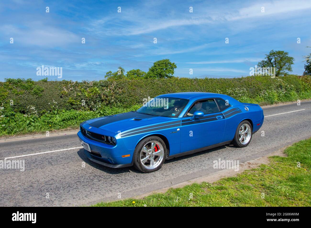 2009 Blue Dodge American 2dr driving on country roads en-route to ...