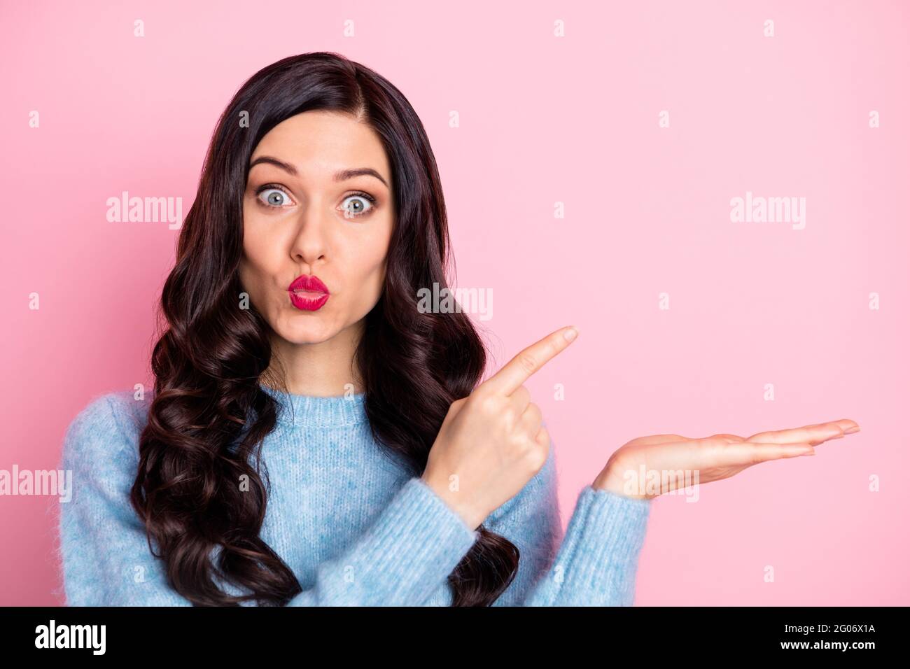 Photo of adorable person kiss lips indicate finger empty space arm palm ...