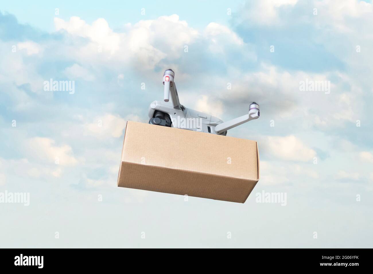 Delivery by Drone against a background of blue sky and white clouds ...