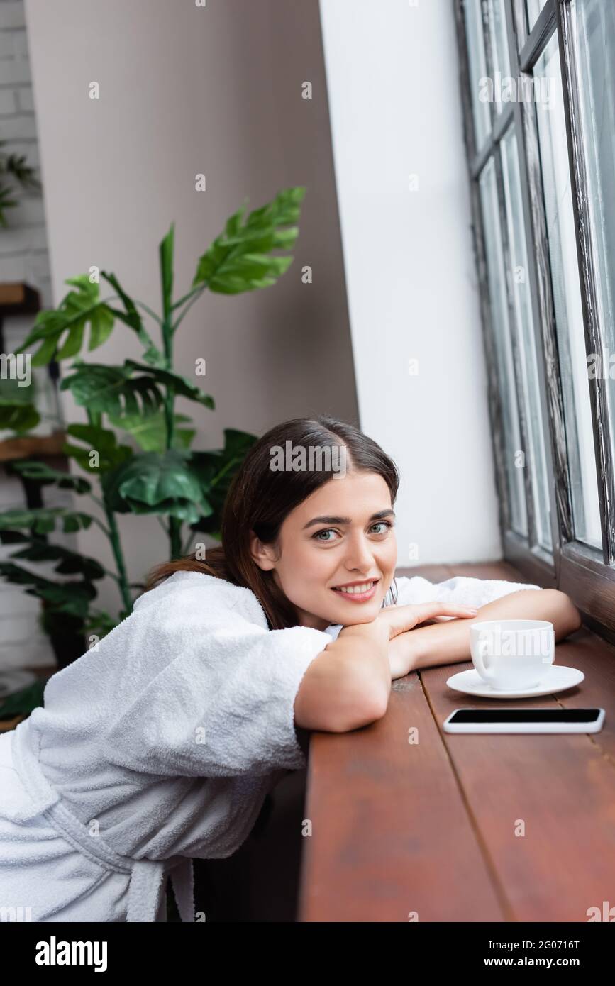 Woman sitting near window hi-res stock photography and images - Alamy
