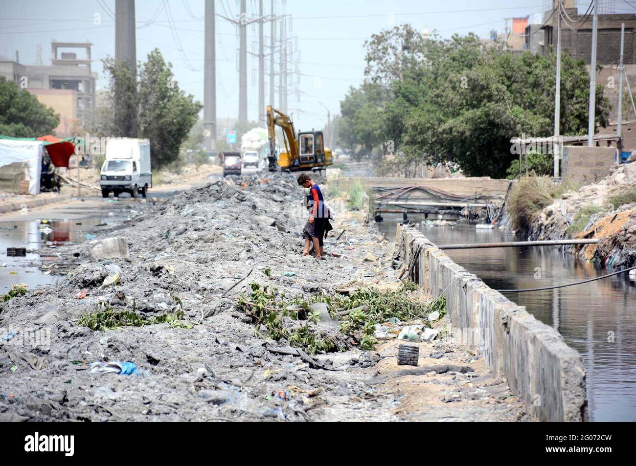 Huge heap of garbage sewerage drain causing blockage of sewerage water ...