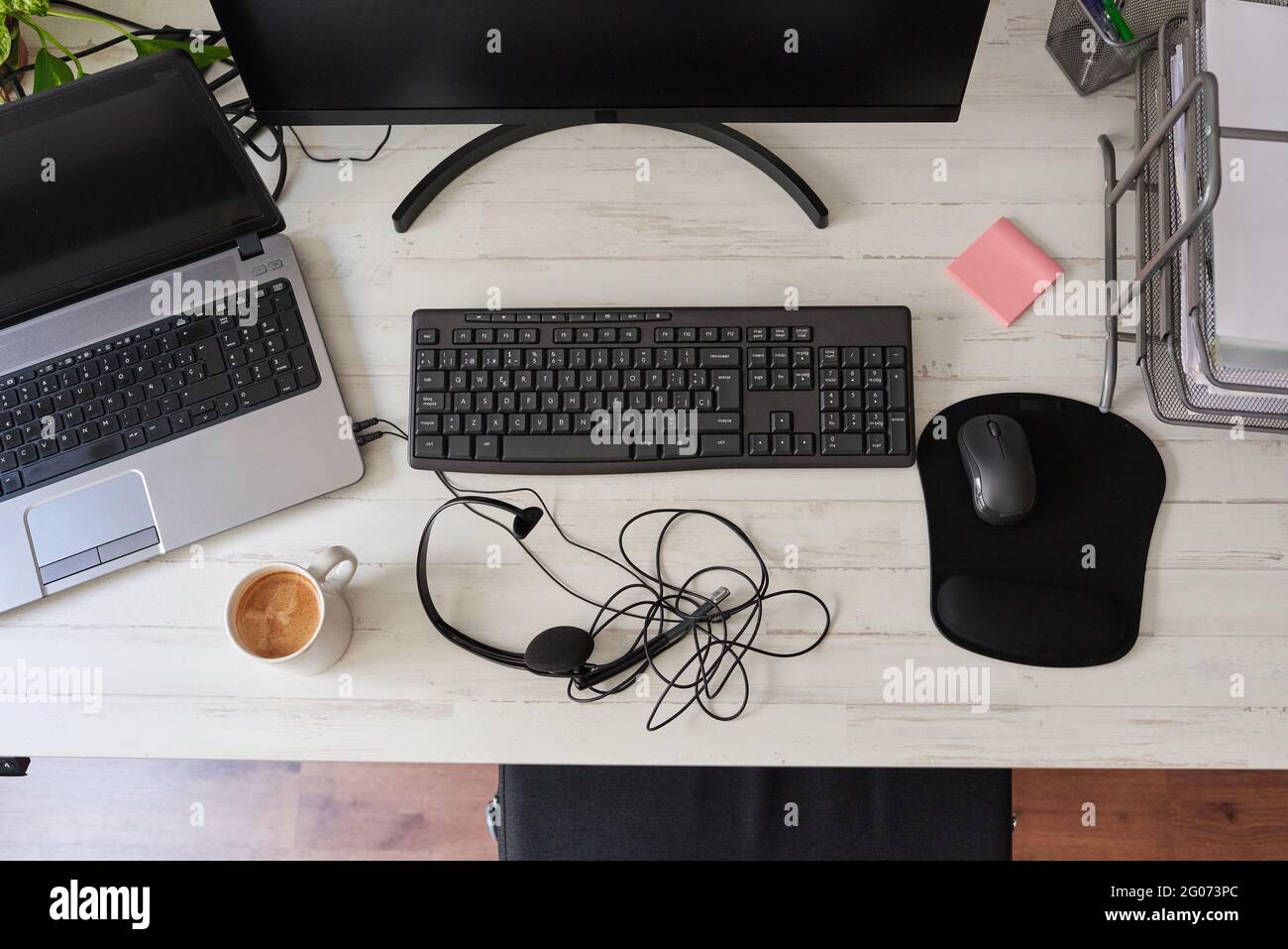 Top view of a desk with computers, headset and a cup of coffee Stock ...