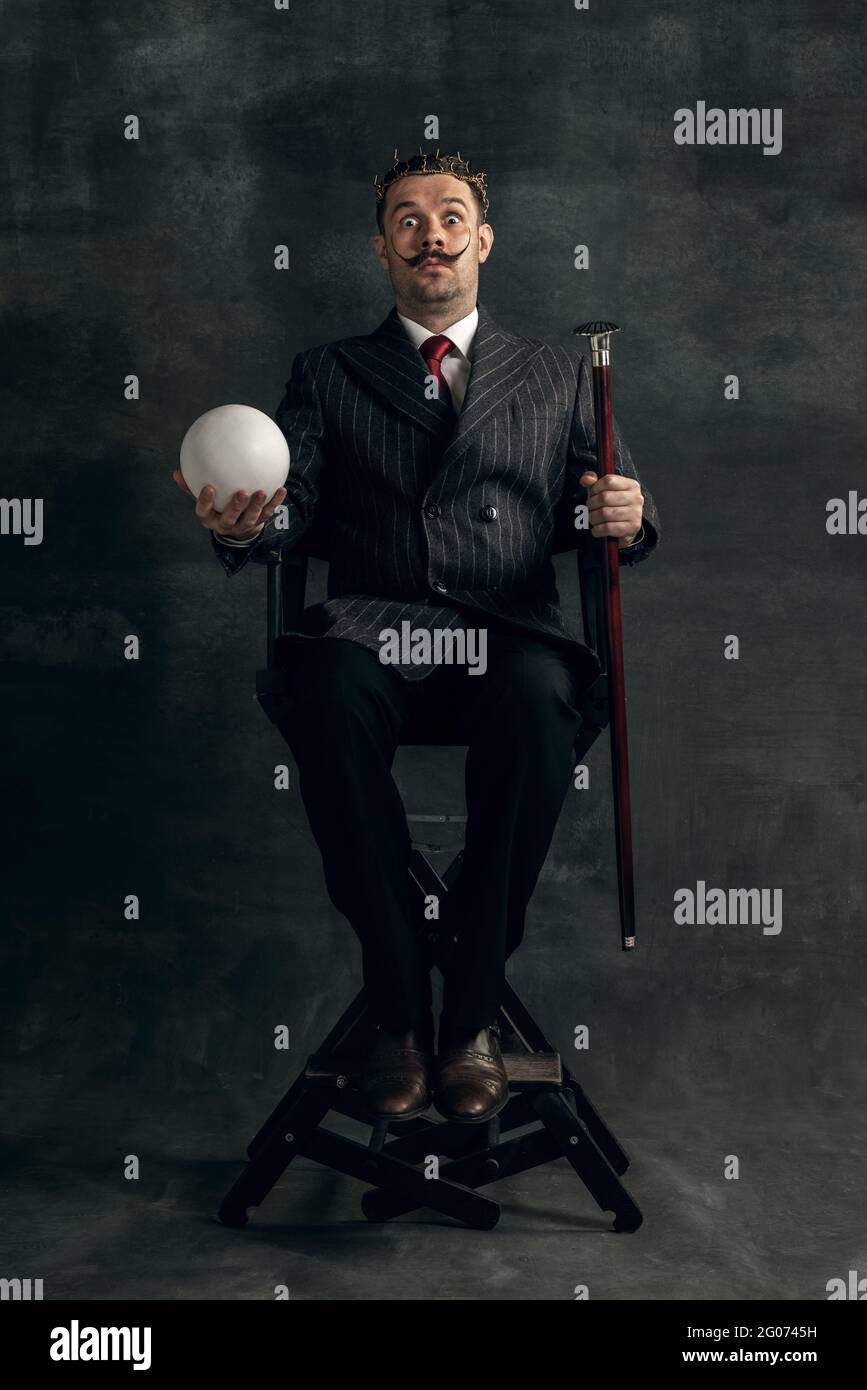 Young man in art action remaking greatest paintings on background ...